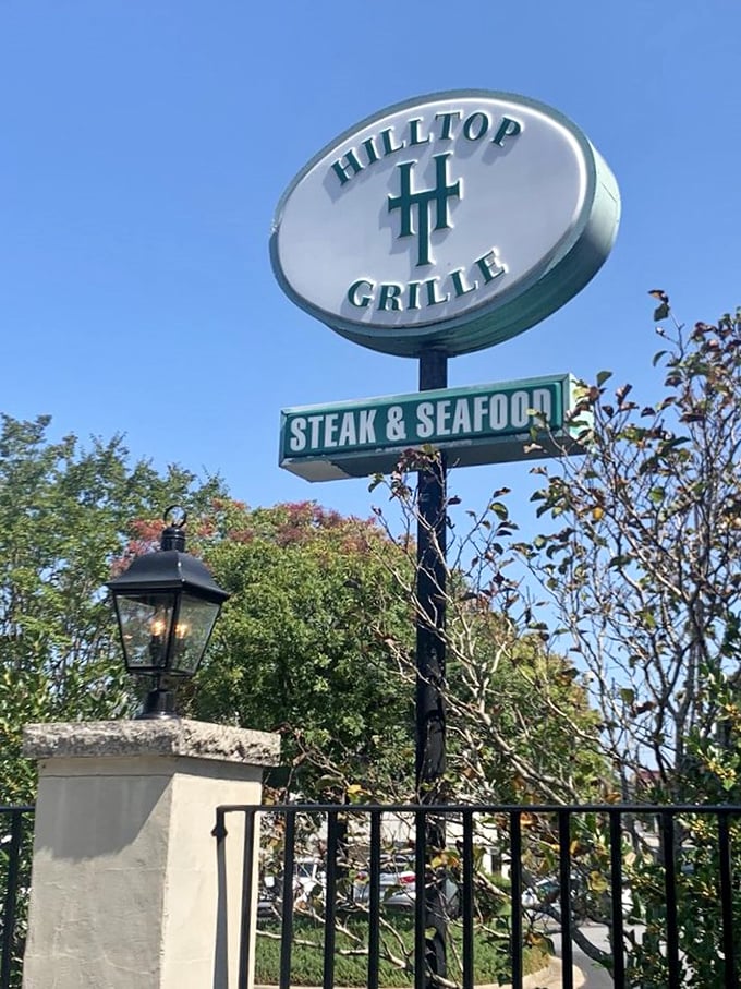 The sign stands tall against the Georgia sky, a beacon for hungry travelers seeking steak and seafood salvation.