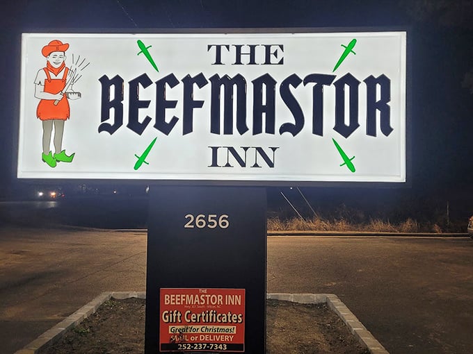 The illuminated sign beckons meat lovers like a lighthouse guiding hungry sailors to safe harbor after a long journey.