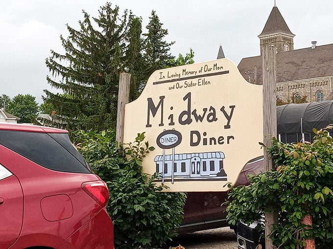 The charming Midway sign stands as a beacon for hungry travelers and a memorial to those who made this humble eatery a community cornerstone.