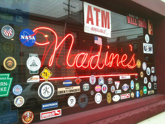 The neon sign and collection of stickers tell Nadine's story better than any review could – this place has history, personality, and zero pretension.