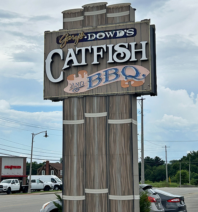 The towering sign stands like a beacon of hope for hungry travelers, promising catfish salvation just off the highway.