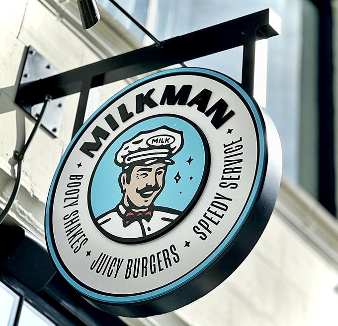 The Milkman sign promises three essential food groups—juicy burgers, body shakes, and speedy service—a trifecta of satisfaction.