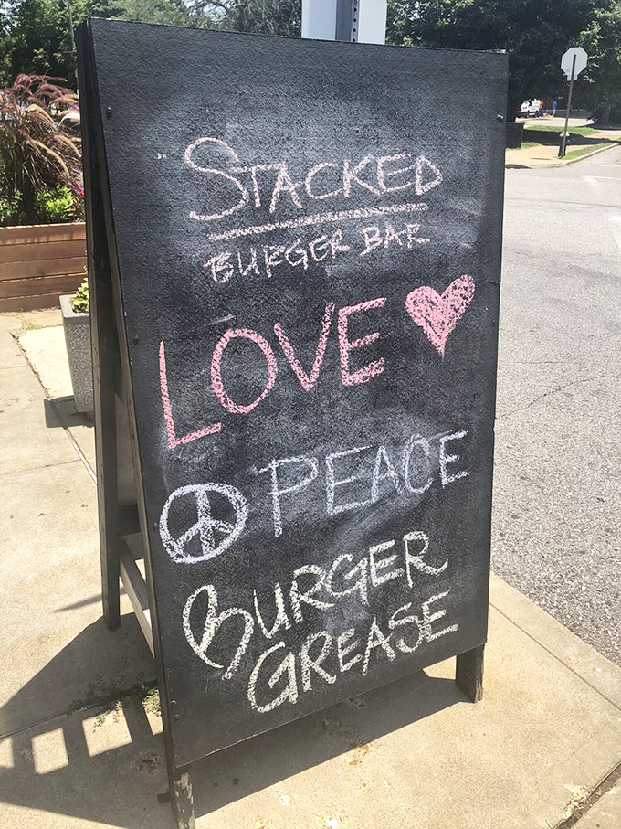 "Love, Peace, Burger Grease"—a sidewalk philosophy we can all get behind. Words to live by, written in chalk.