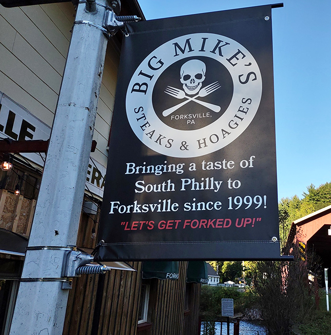 The unofficial coat of arms of Forksville since 1999—a skull and crossed utensils that don't say "danger" but rather "deliciousness ahead."