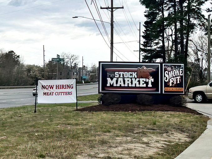 Bold signage announcing barbecue excellence – The Stock Market and Smoke Pit delivering meaty investment returns.