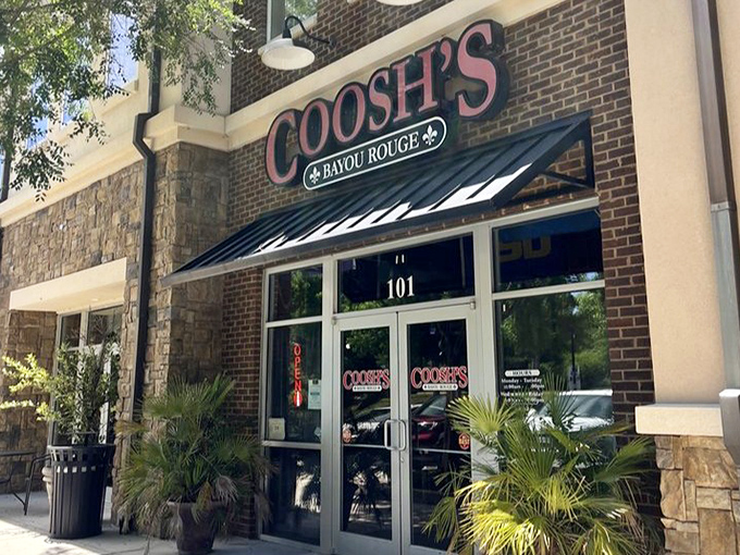 The storefront stands like a portal between worlds—step through these doors and suddenly you're in Louisiana without the airfare or alligator-dodging skills.