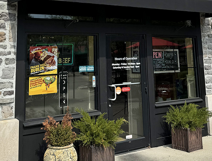 Hours of operation clearly posted—crucial information for planning your sandwich strategy. Nothing worse than arriving with a Reuben craving to find locked doors.
