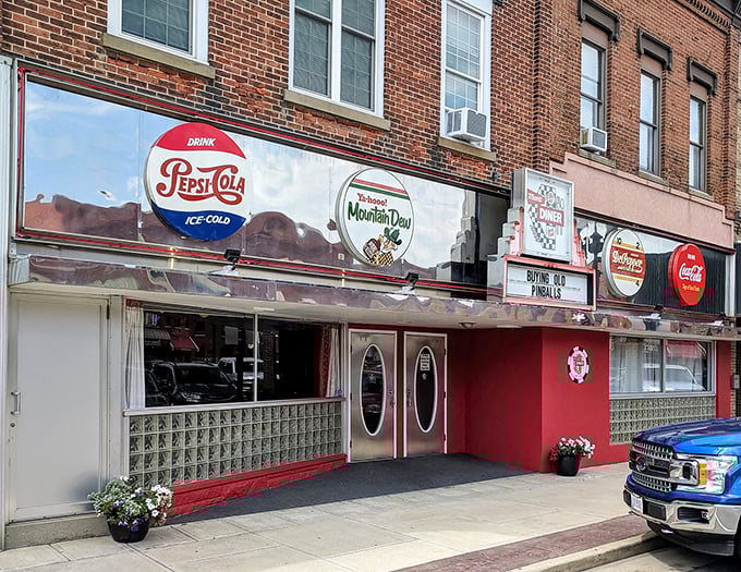 The storefront proudly displays vintage soda signs like badges of honor. This isn't just a restaurant—it's a preservation society for American food culture.