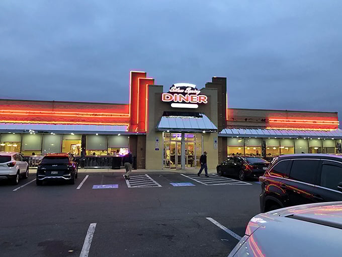As evening falls, Silver Spring Diner glows like a lighthouse for the hungry, its neon promising safe harbor from cooking your own dinner.
