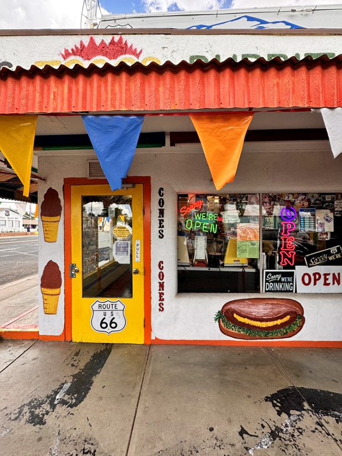 A storefront that promises more than food—it offers a time machine disguised as a diner, complete with colorful bunting and neon optimism.