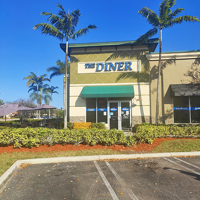 The Diner's exterior stands proudly against that impossibly blue Florida sky, like a beacon calling hungry travelers home.