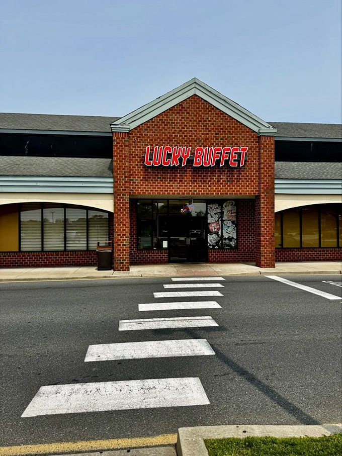 The Lucky Buffet storefront stands proudly against a blue sky, like the entrance to an amusement park where all the rides are delicious and the lines are at the buffet.
