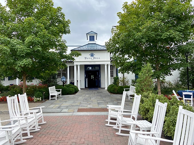 The entrance promises what the interior delivers: timeless elegance with a dash of small-town charm. Those rocking chairs aren't just seating—they're an invitation.