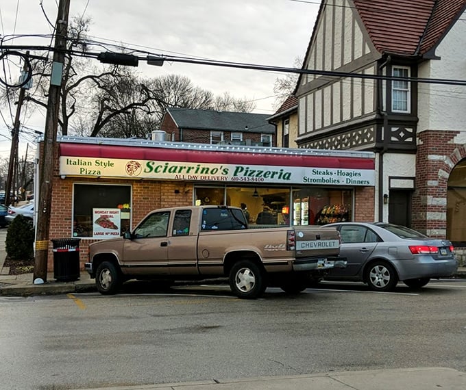 From this humble storefront, pizza dreams come true. The sign promises "Italian Style Pizza"—and Sciarrino's delivers on that promise with every pie.