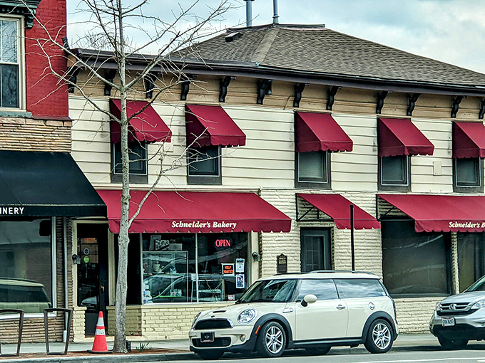 The distinctive red awnings of Schneider's Bakery stand out on Westerville's State Street like beacons guiding hungry travelers to donut salvation.