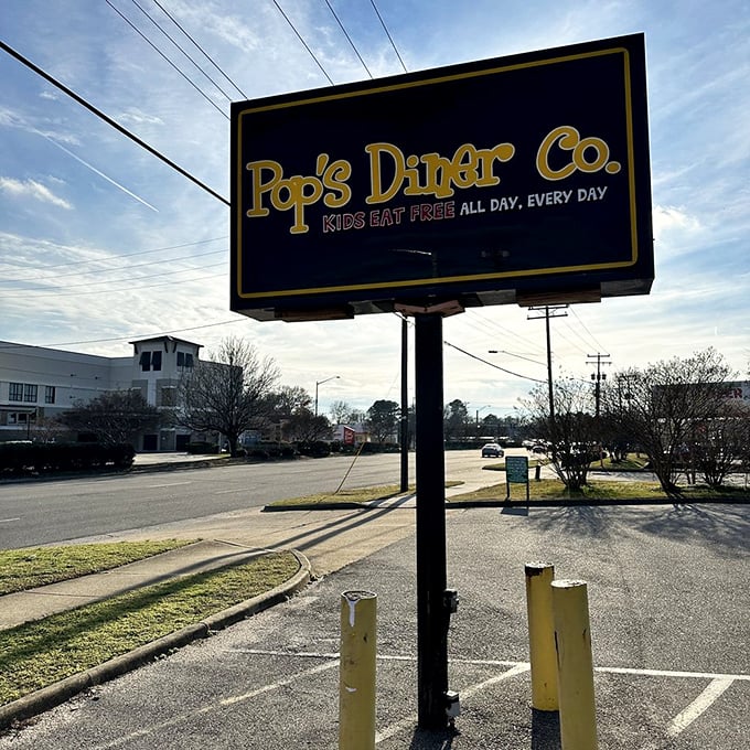 The roadside sign announces "Kids Eat Free" against the sky—words that sound like music to parents' ears everywhere.