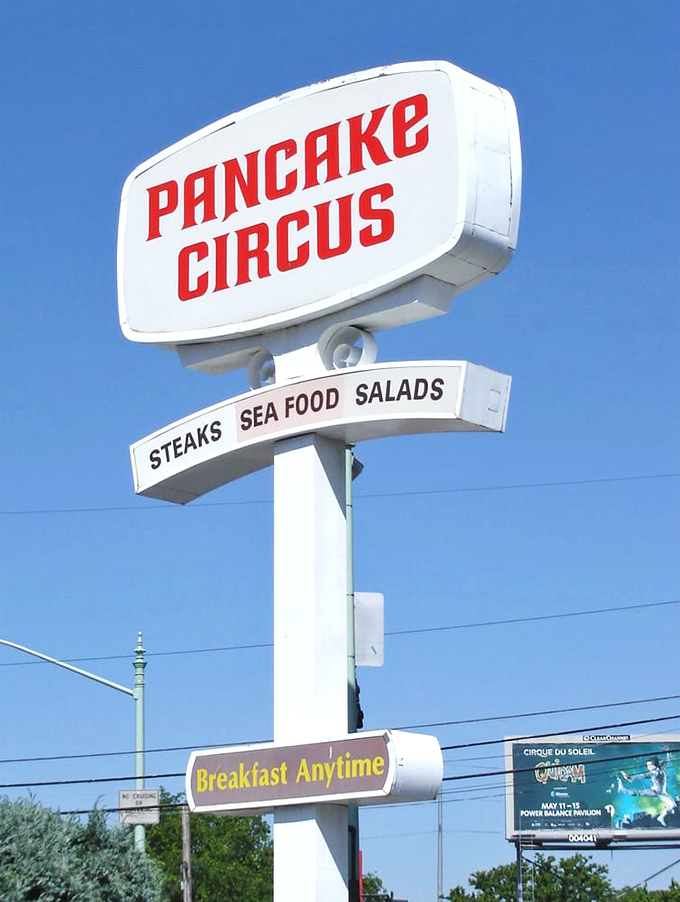 The vintage roadside sign promises "Breakfast Anytime"—three syllables that might be the most beautiful phrase in the English language.