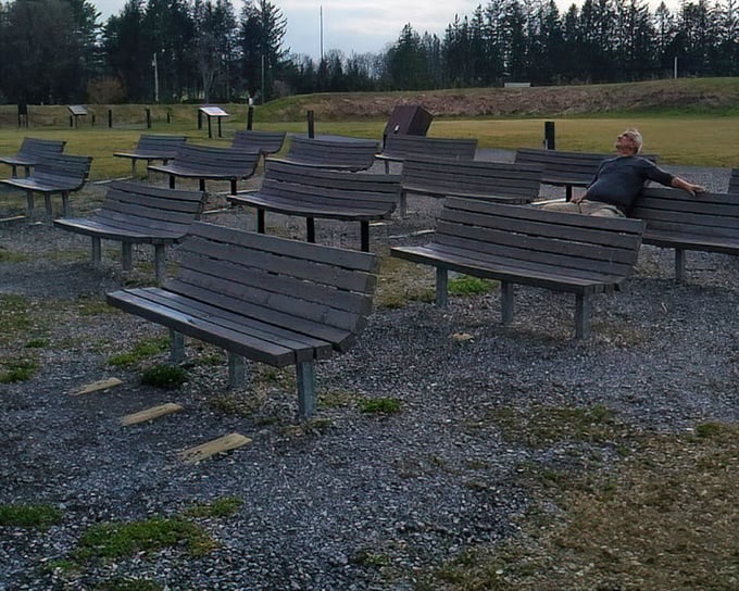 The night sky amphitheater – where wooden benches face upward toward the greatest show in the universe. Front row seats to infinity.