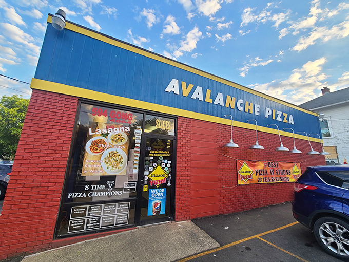 Avalanche Pizza's bold blue and red exterior isn't subtle – like their toppings! This Athens landmark screams "pizza champion" from every angle.