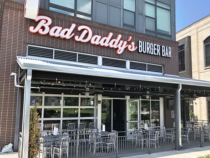 Bad Daddy's exterior beckons with its bold signage and inviting patio – a temple to burger worship where calories don't count.