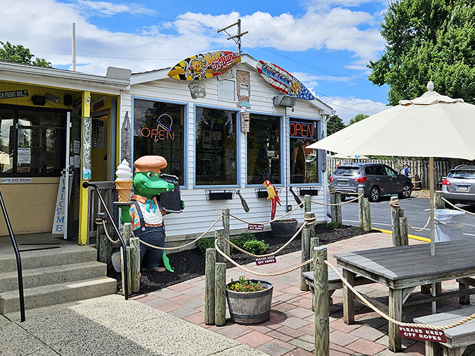 Beach vibes in landlocked Frederick! Beef 'n Buns 'n Paradise brings coastal charm with its surfboard sign and frog mascot holding an ice cream cone.