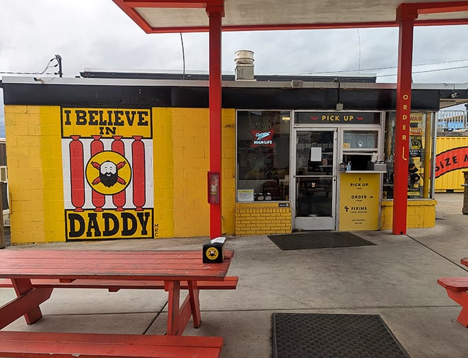 The bright yellow "I BELIEVE IN DADDY" wall isn't just Instagram-worthy—it's a beacon calling all hot dog enthusiasts to their happy place.
