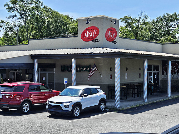 Dano's Pizza welcomes you with its cheerful red sign and classic white columns. A neighborhood gem where pizza dreams come true.