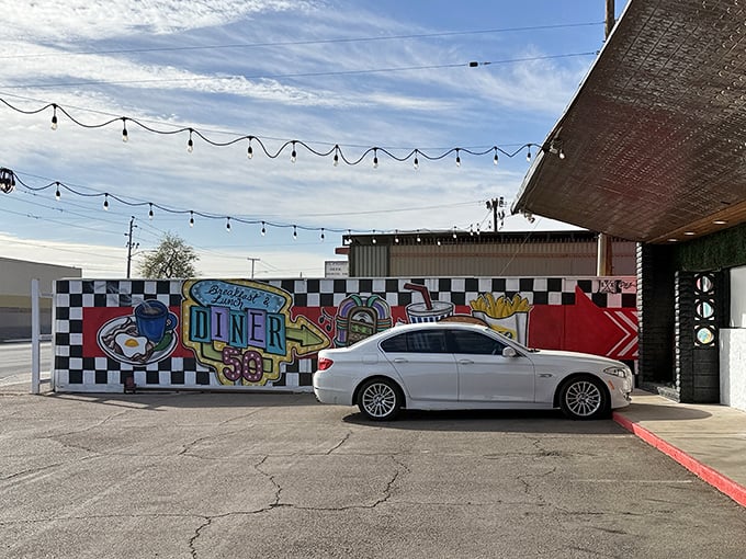 Colorful checkered walls and a playful mural welcome you to Diner 50 – where breakfast dreams come true in Phoenix's hidden gem.