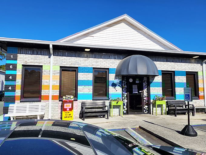 Early Bird Diner's rainbow-striped exterior isn't just eye-catching—it's a promise that breakfast here will be anything but boring.