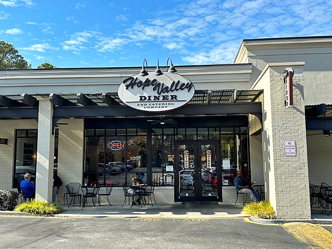 The classic sign beckons like an old friend promising comfort food that hugs your soul. Blue skies above, good eats ahead!