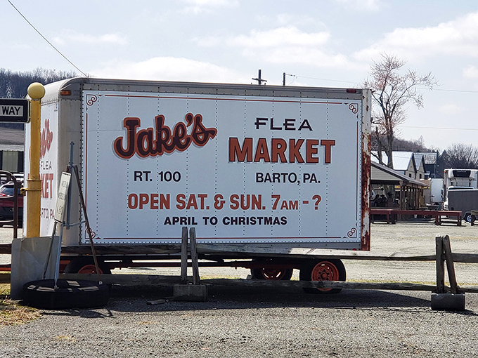 That trailer sign has more personality than most billboards! Jake's vintage marquee promises treasures from April to Christmas—the question mark after closing time is delightfully honest.