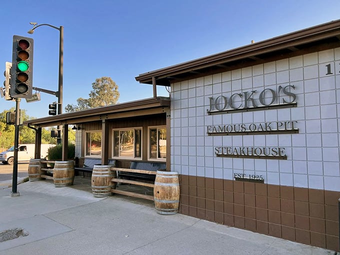 Jocko's exterior welcomes you with rustic charm. Those wooden barrels aren't just for show – they hint at the smoky oak-pit flavors waiting inside.