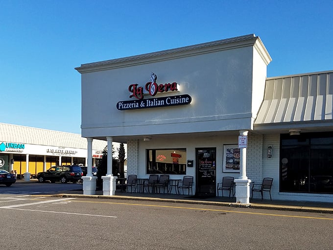 La Vera's unassuming storefront hides pizza treasures within. Like finding a Picasso at a yard sale!