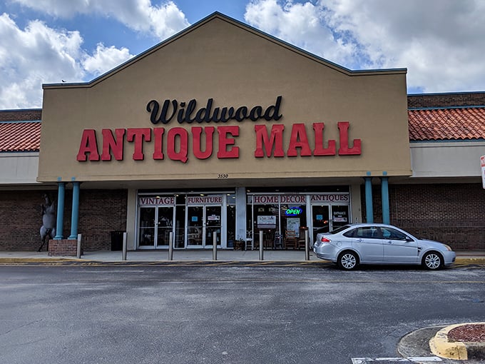 The Wildwood Antique Mall beckons with its bold red signage – a siren call to treasure hunters and nostalgia seekers alike.