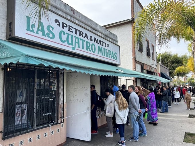 The line at Las Cuatro Milpas stretches down the block – a sure sign that food paradise awaits inside.