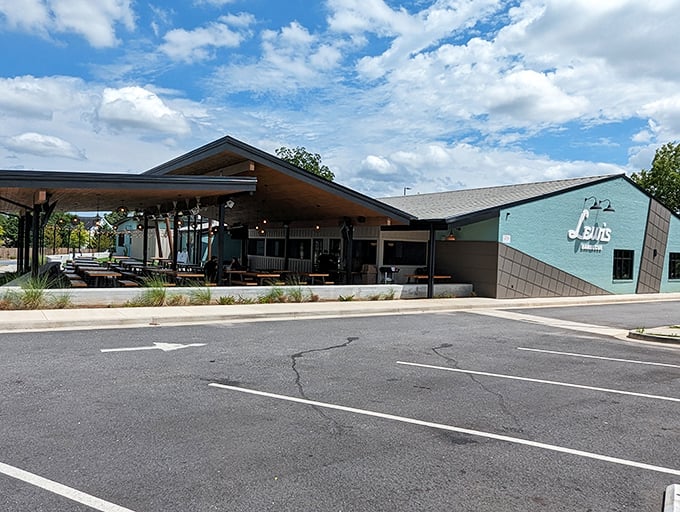 Lewis Barbecue's modern turquoise exterior might surprise you, but trust me—the smoke signals coming from inside tell the real story.