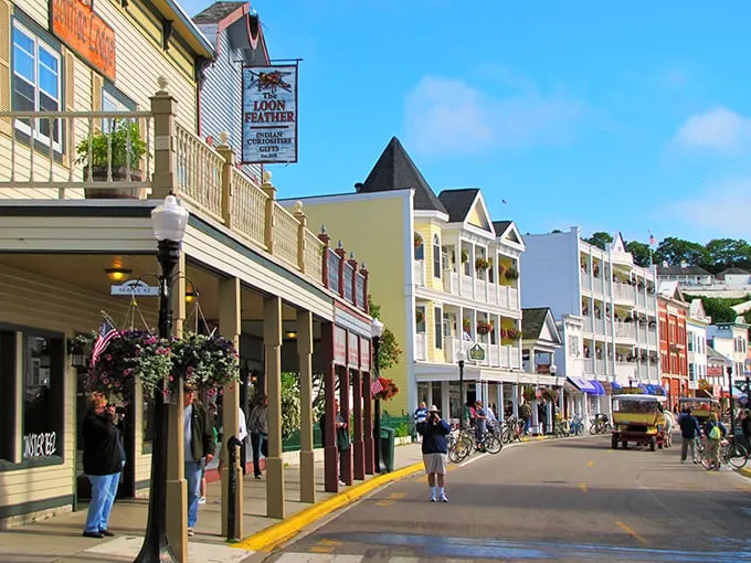 Main Street on Mackinac Island looks like a movie set with its colorful storefronts and horse-drawn carriages. No cars allowed—just the clip-clop of hooves on historic pavement!