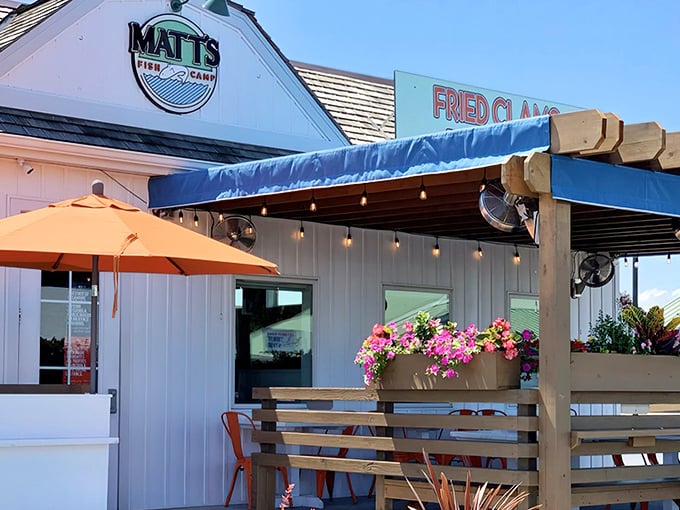 Matt's Fish Camp exterior beckons with its blue awning and "Fried Clams" sign – a humble facade hiding seafood treasures that would make Neptune jealous.