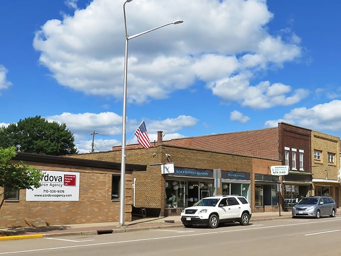 Merrill's main street showcases classic Americana with its brick buildings and proudly displayed flags. Small-town charm at its finest!