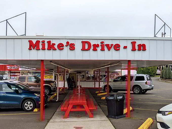 Mike's Drive-In's classic red and white exterior isn't just nostalgic—it's a time machine that happens to serve incredible burgers!