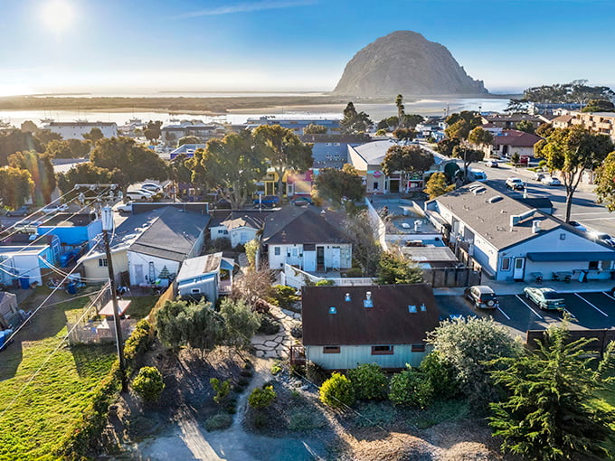 That's Morro Rock standing guard like nature's own bouncer, keeping the Pacific in check.