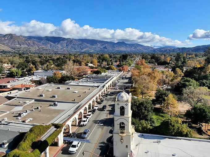 Ojai from above—where mountains cradle a Spanish-style shopping arcade like they're showing off their favorite child.