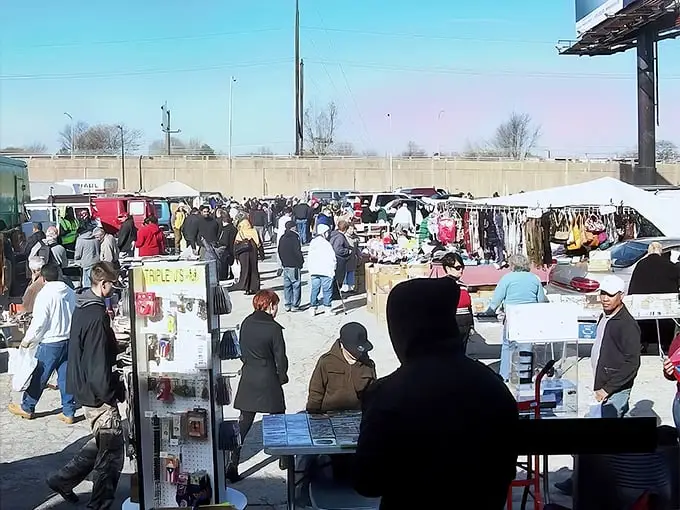 Bargain hunters paradise! The Quaker City Flea Market buzzes with energy as shoppers weave through tables of treasures under the open sky.