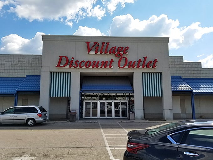 The iconic red lettering of Village Discount Outlet promises treasure hunting adventures that'll make your wallet sing with joy.