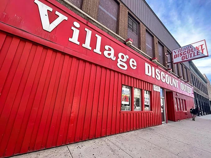 That bold red storefront practically shouts "bargains inside!" like a friendly carnival barker welcoming treasure hunters.