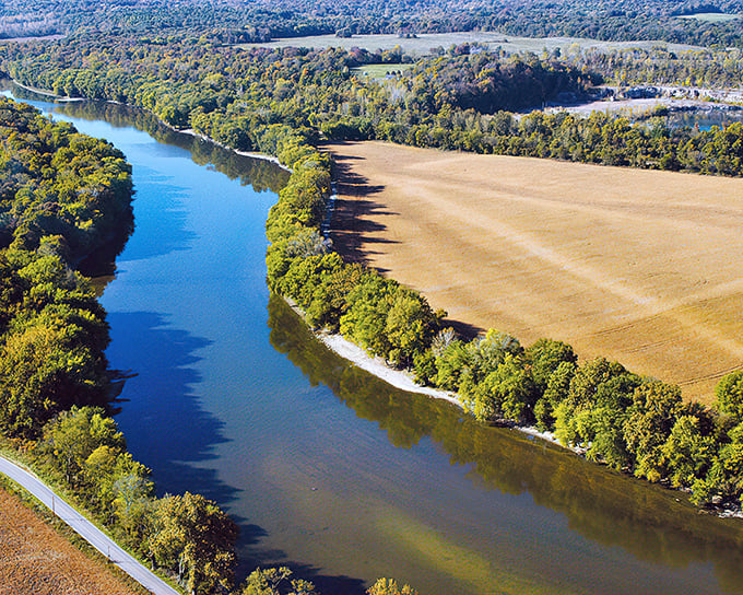 The Whitewater Canal Scenic Byway offers nature's perfect mirror – where Indiana's blue waters meet golden farmlands in a timeless embrace.