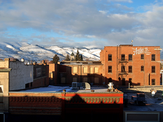 Snow-capped mountains frame Baker City's brick buildings, offering a backdrop that ski resorts would pay millions to advertise.