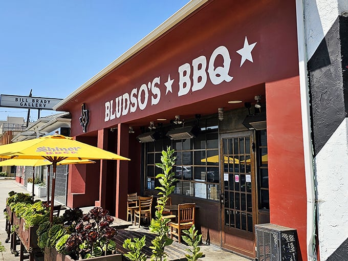 Bludso's iconic storefront with its yellow umbrellas beckons BBQ pilgrims like a meaty lighthouse on La Brea Avenue.