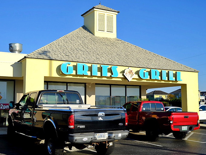 Morning sunshine gleams off Grits Grill's cheerful yellow building – where breakfast dreams come true on the Outer Banks.