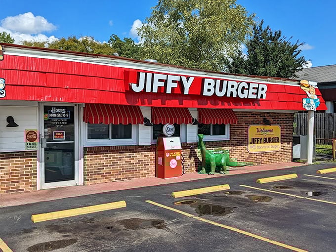 The classic red awning of Jiffy Burger beckons like a time machine to when drive-ins ruled and burgers were king.
